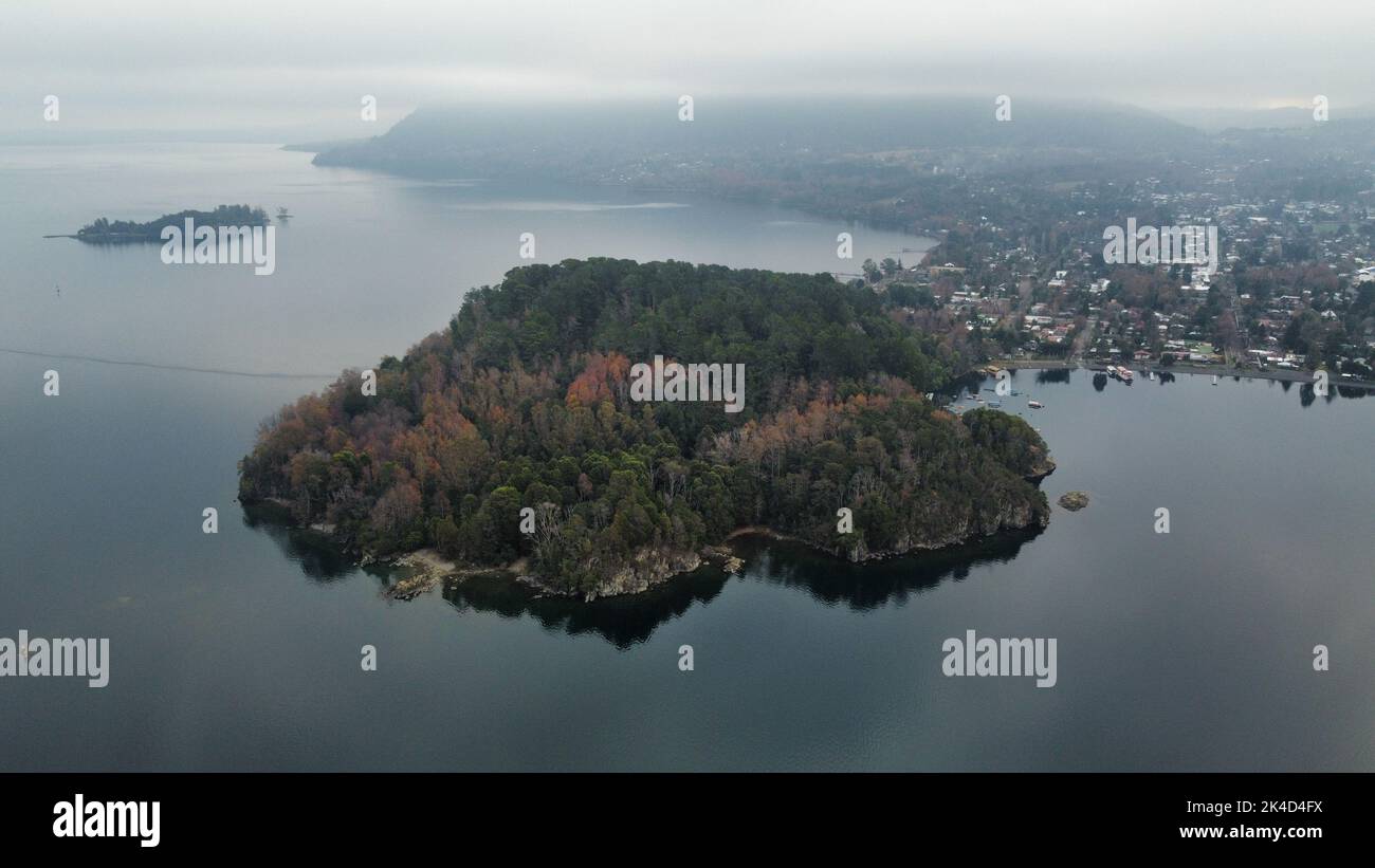 An aerial view of beautiful Islands with buildings and dense trees ...