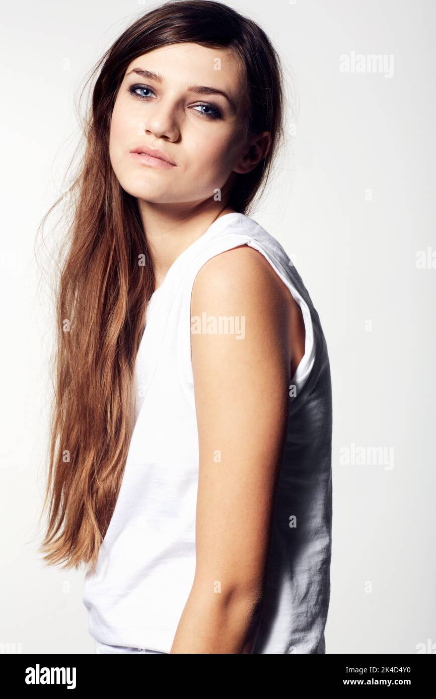 Fresh look - Fashion in Studio. A gorgeous young woman posing in studio ...