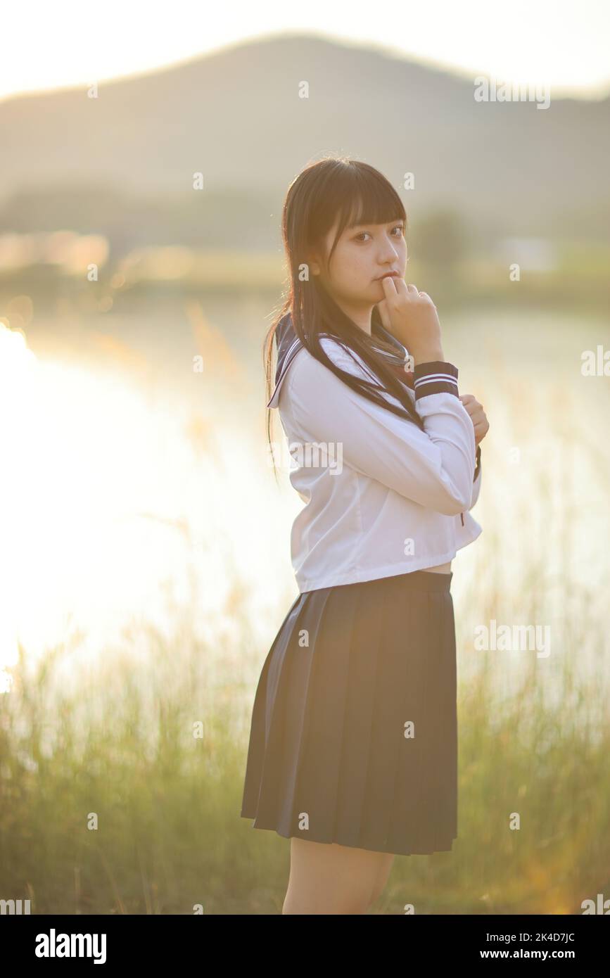 Asian High School Girls student looking at camera in countryside with sunrise Stock Photo - Alamy