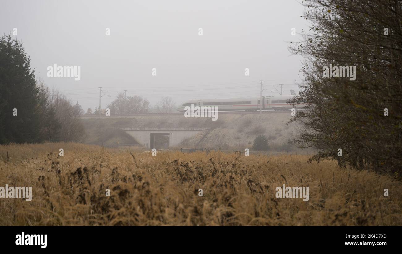 A ICE Train on a foggy day in Denkendorf, Germany Stock Photo - Alamy
