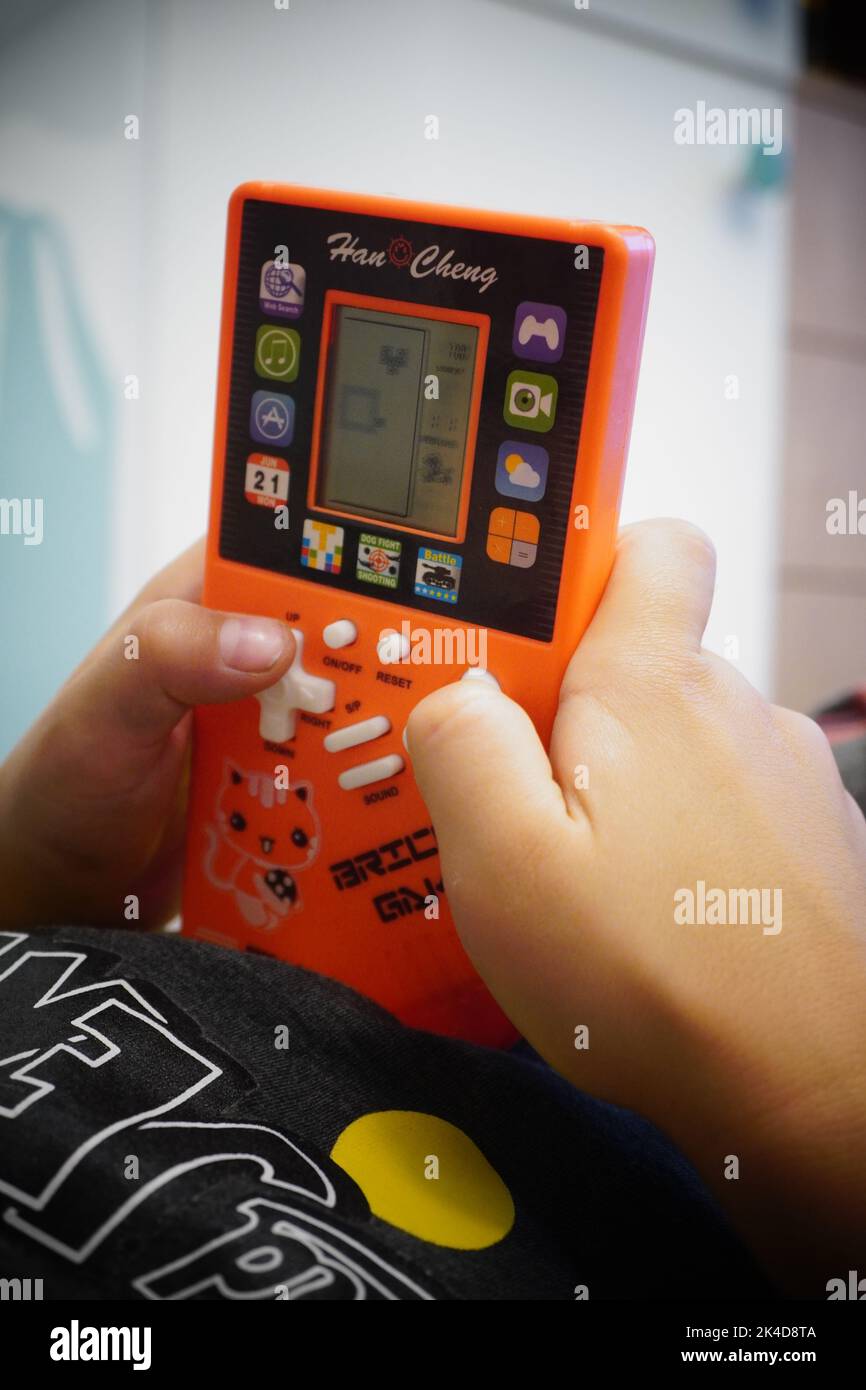 A Han Cheng brick game hand console in monochrome colors Stock Photo ...
