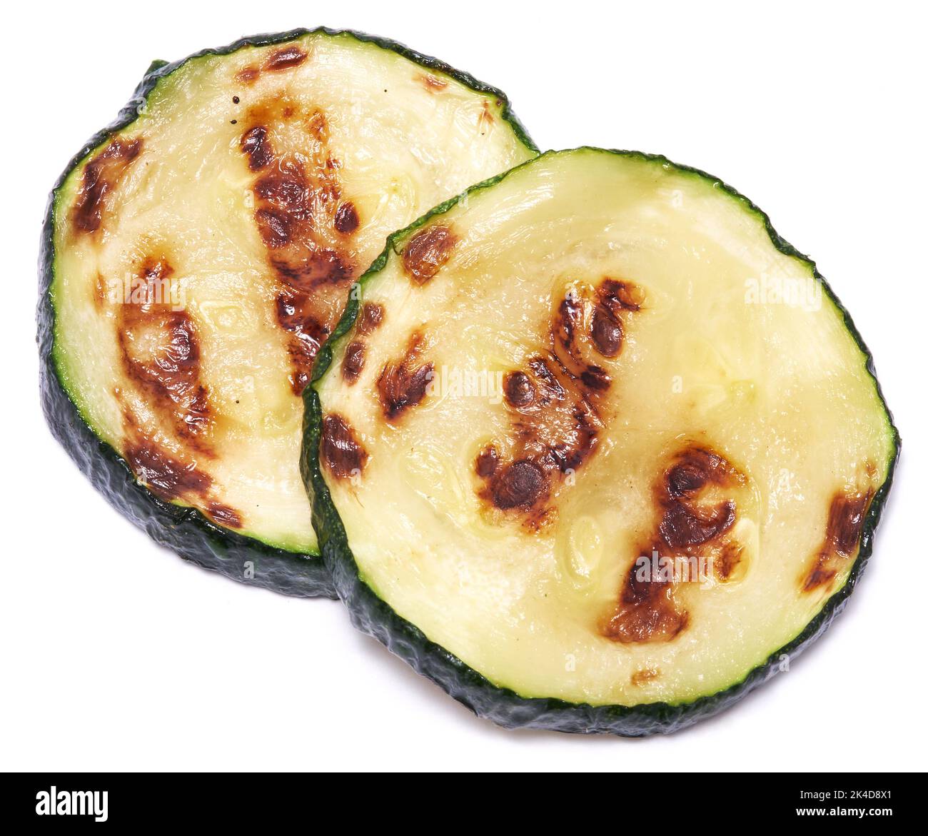 Slices of zucchini roasted on a grill with stripes from a grill ...