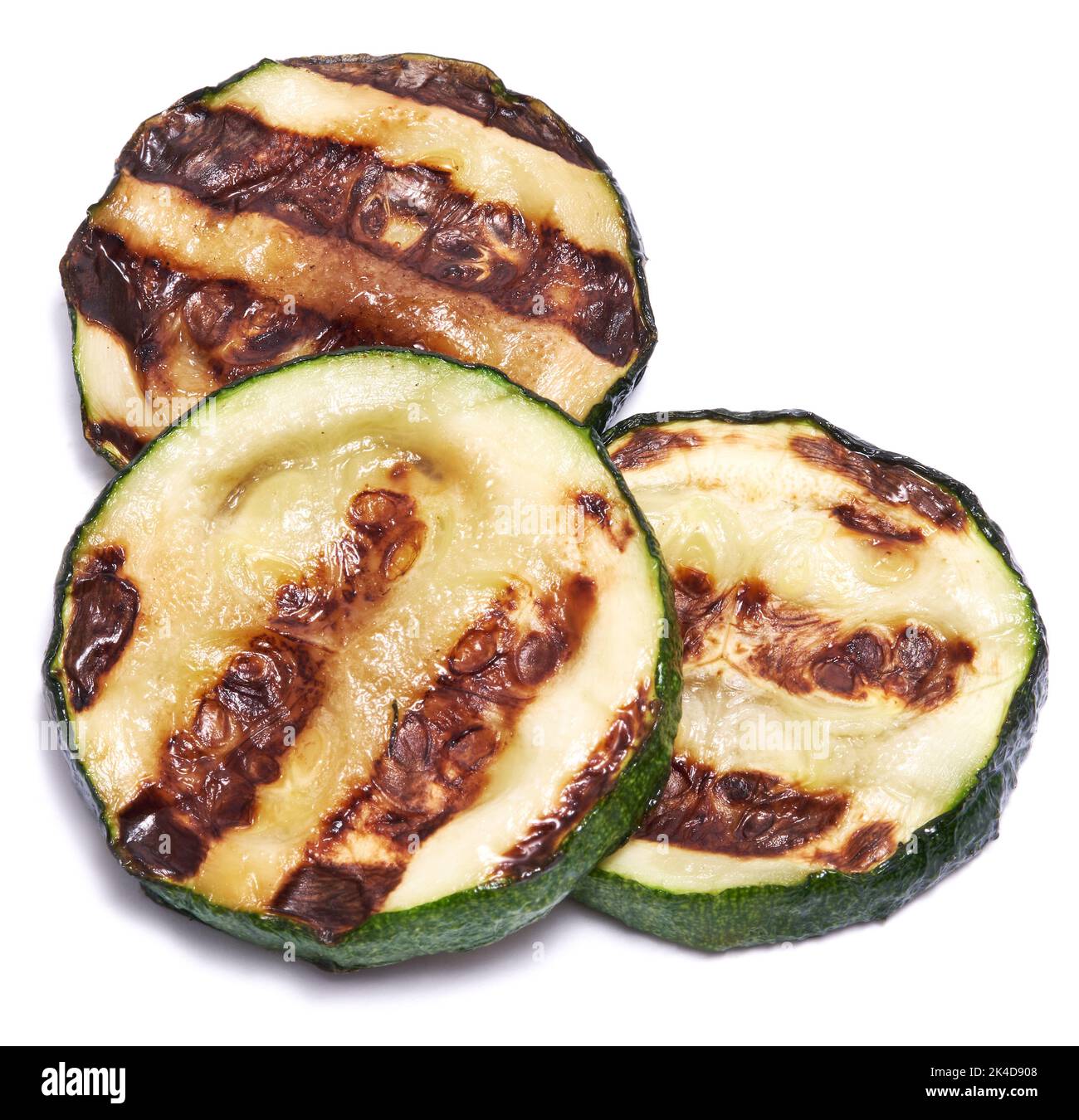 Slices of zucchini roasted on a grill with stripes from a grill ...