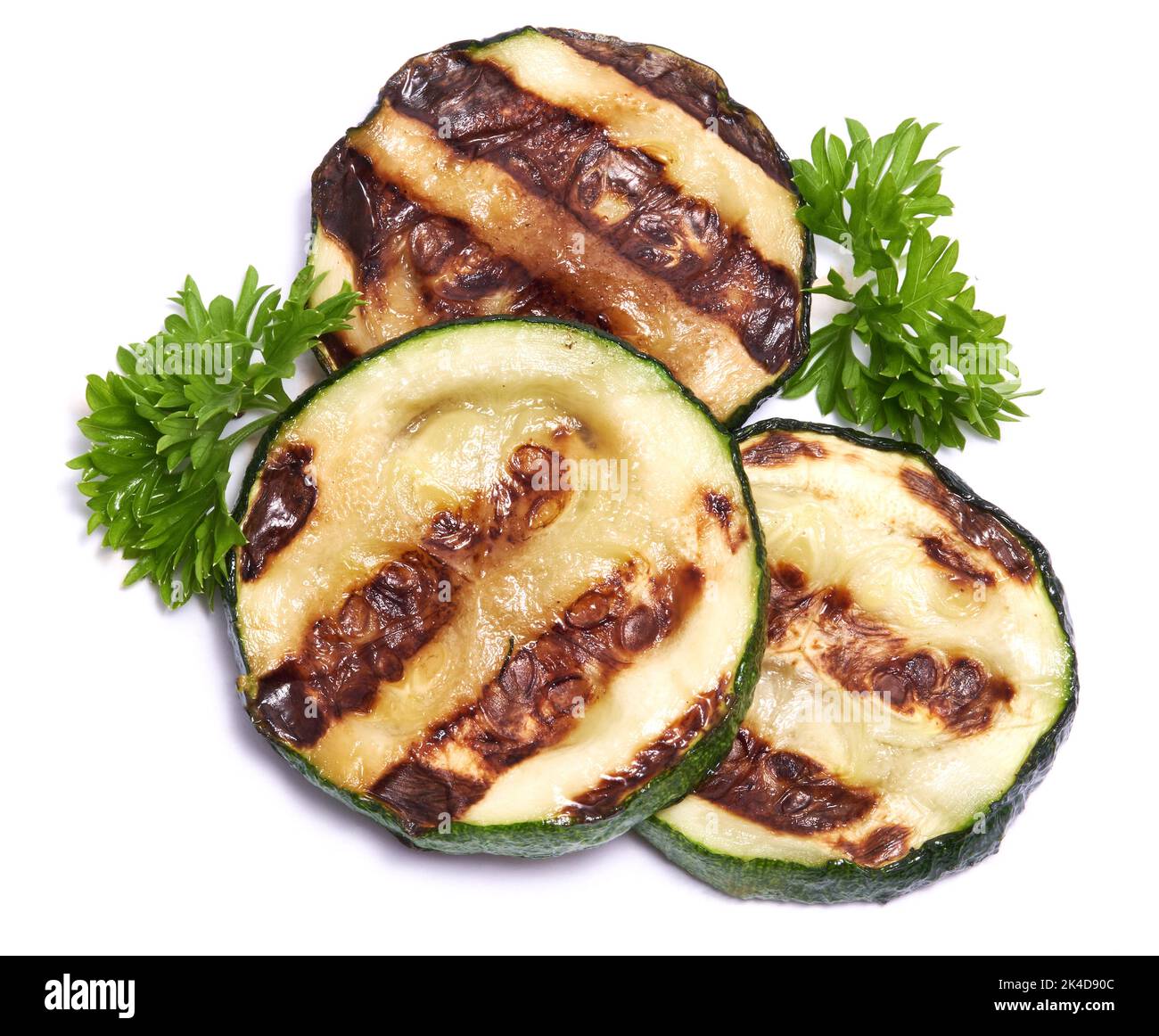 Slices of zucchini roasted on a grill with stripes from a grill ...