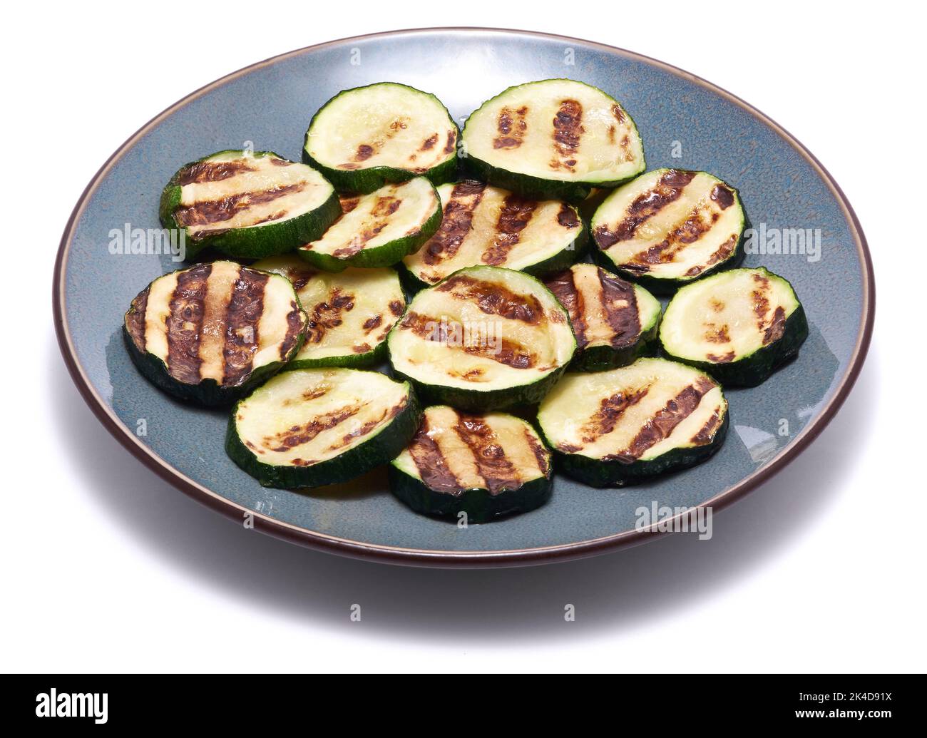Slices of zucchini roasted on a grill with stripes from a grill ...