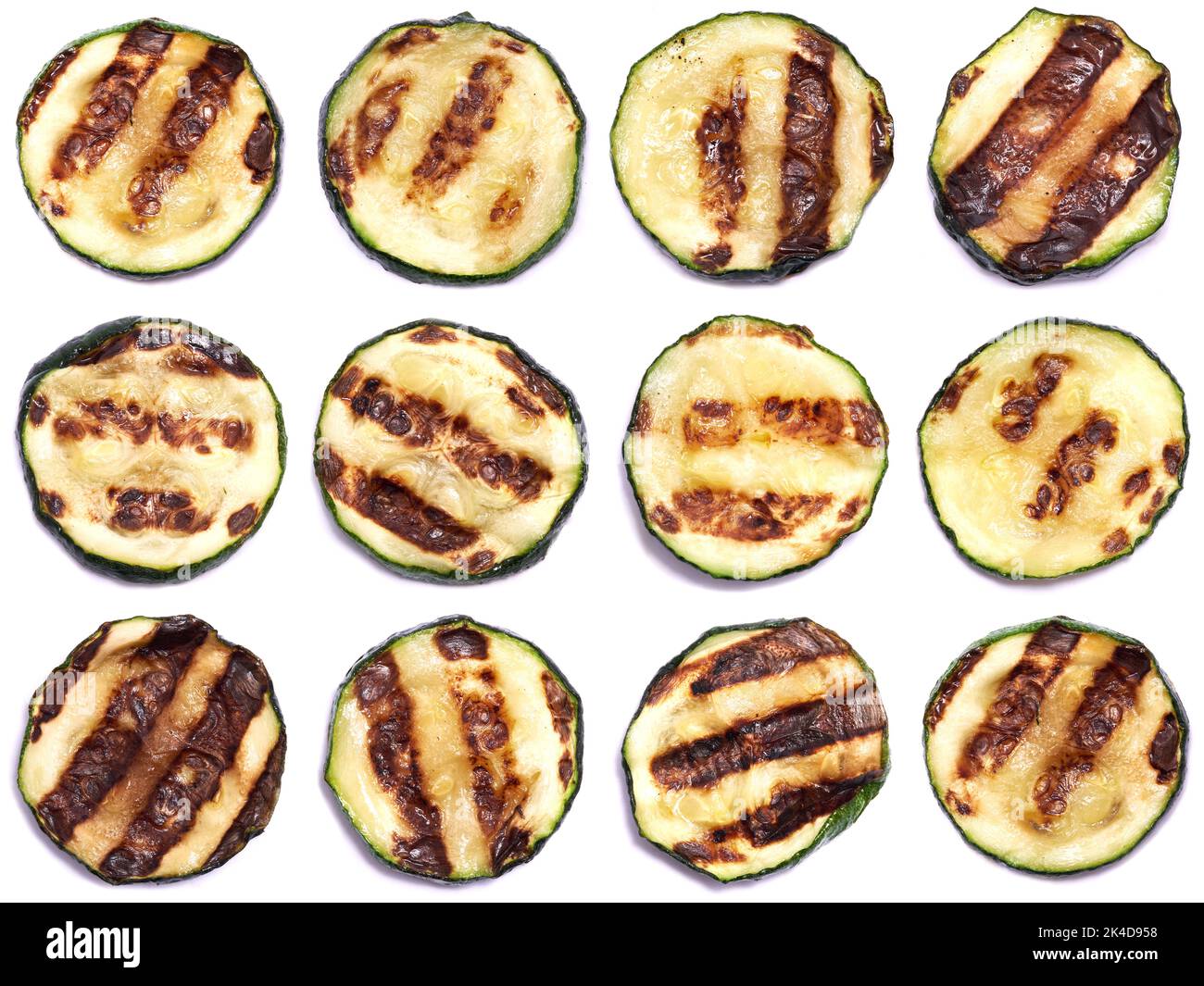 Slices of zucchini roasted on a grill with stripes from a grill ...