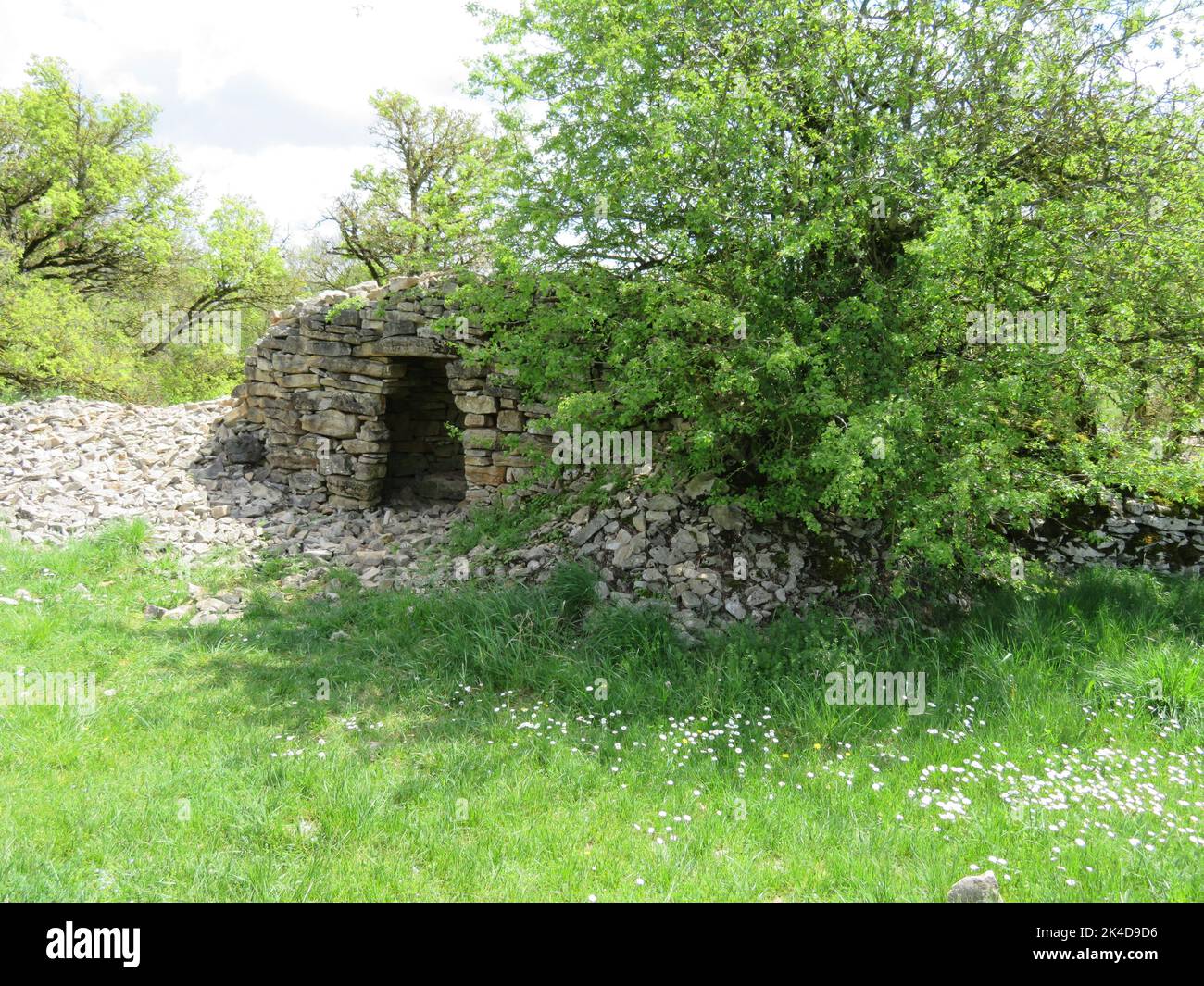 A beautiful small old room made of stones in a greenfield Stock Photo ...