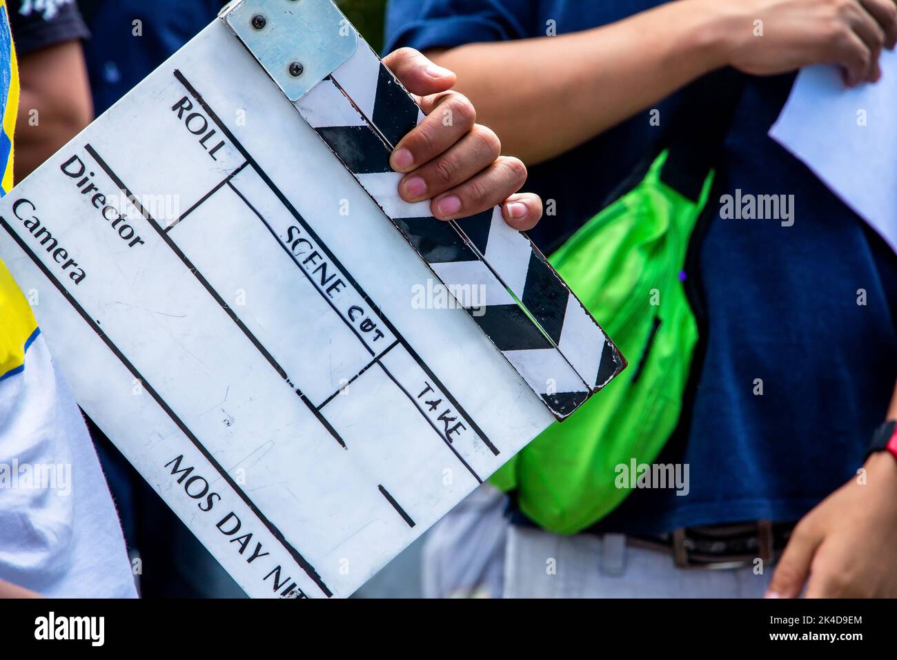 close up image of film production crew holding Film Slate on set Stock ...