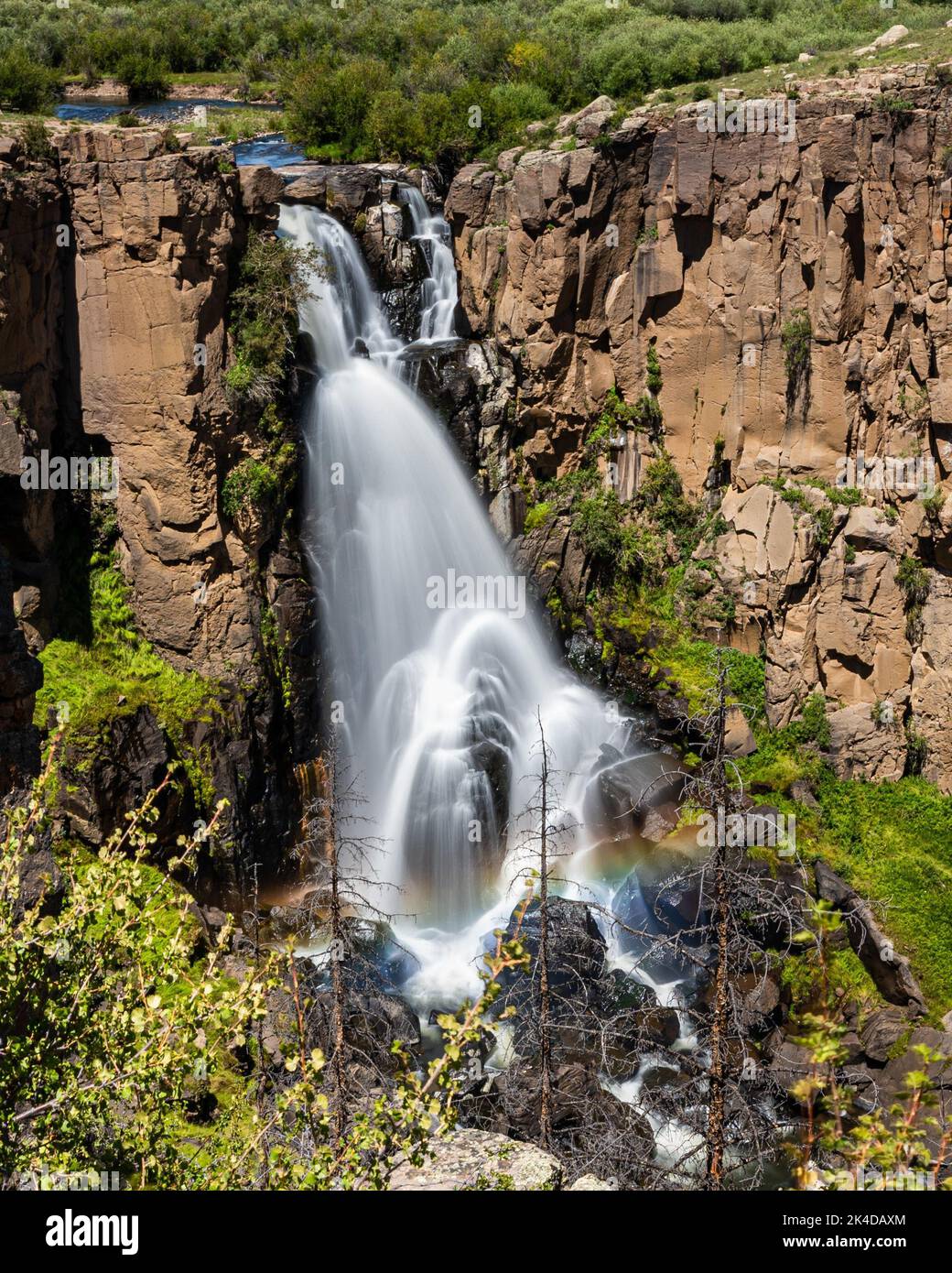 A vertical closeup of North Clear Creek falls flowing from a mountain ...
