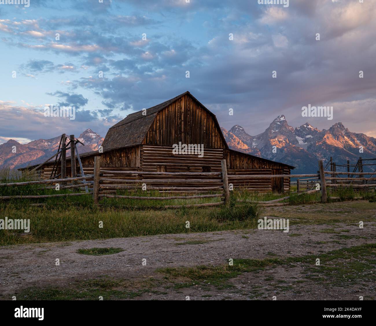 A low angle of a Mormon Row Teton national park view with a wooden ...