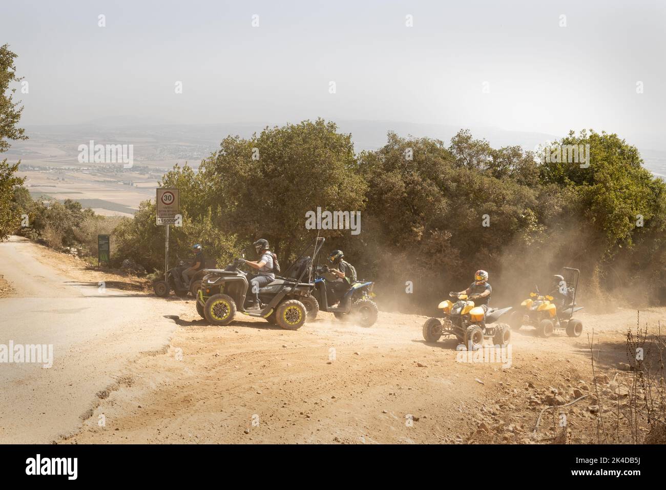 group of people riding quad bikes on mount Carmel, Israel Stock Photo ...