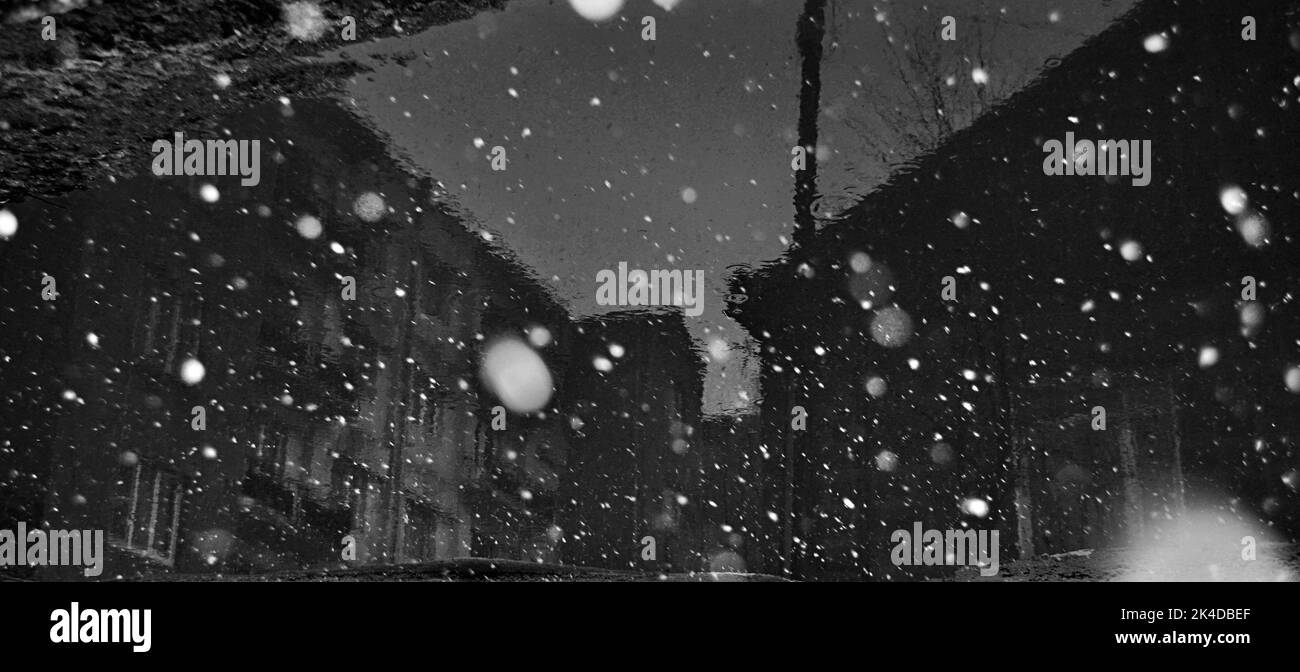 Snow particle reflection on the water Stock Photo - Alamy