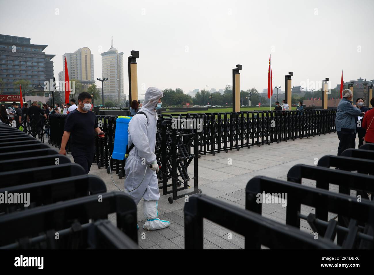 XI'AN, CHINA - OCTOBER 1, 2022 - A staff member performs disinfection ...