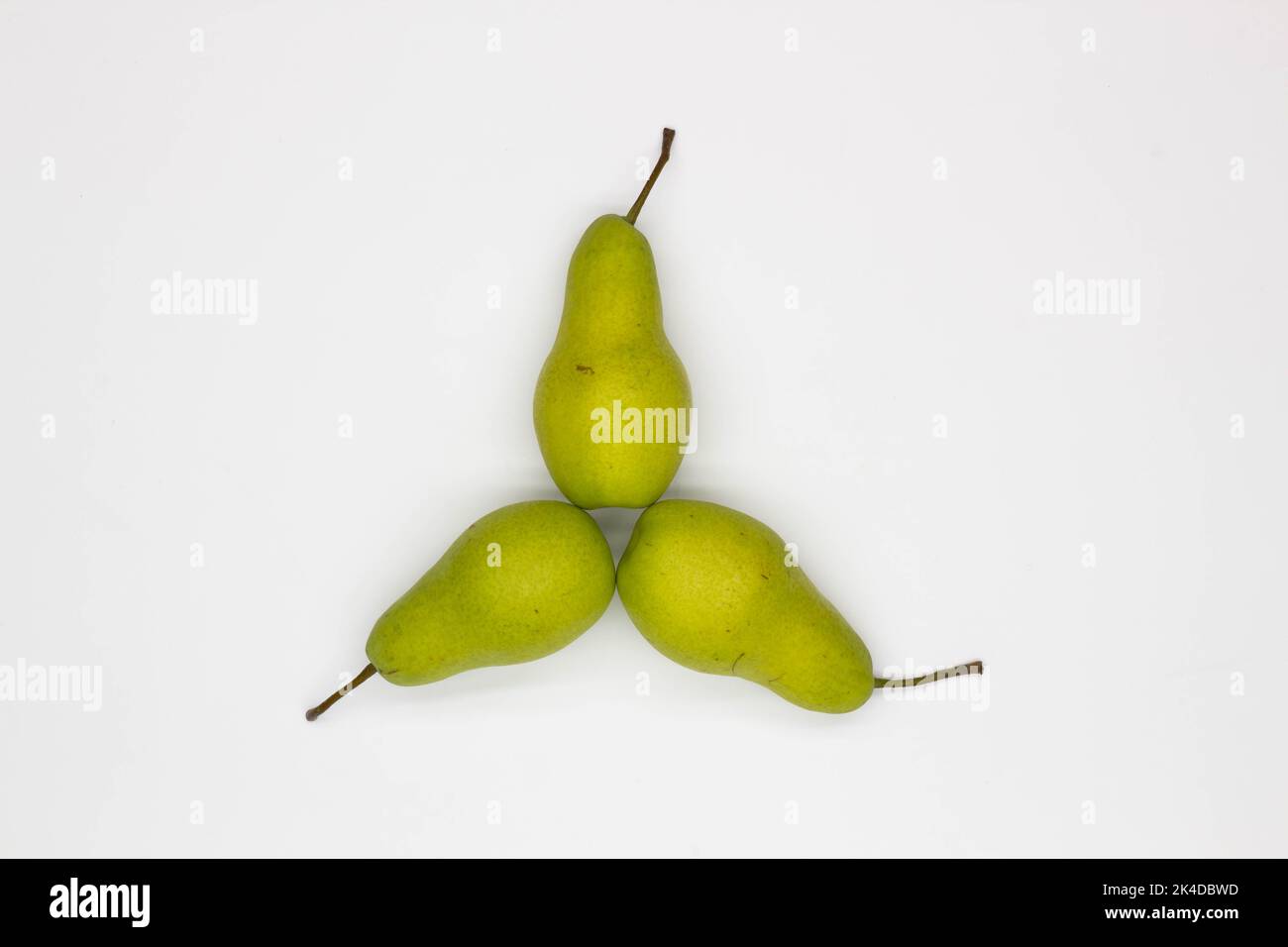 Pears are laid out in a triangle on white background. Isolated. Ripe ...