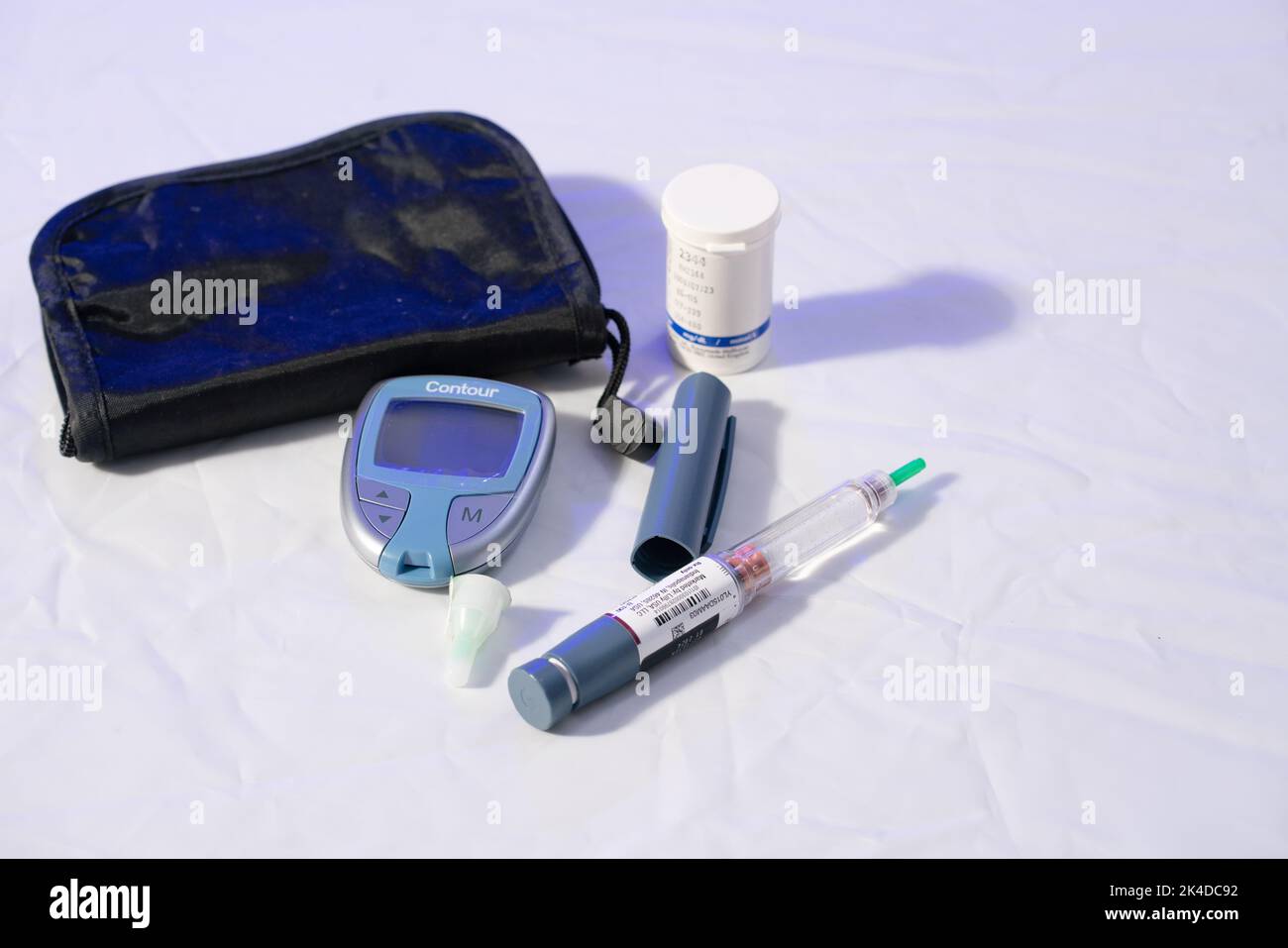 Insulin pen and blood glucose meter on white background Stock Photo - Alamy