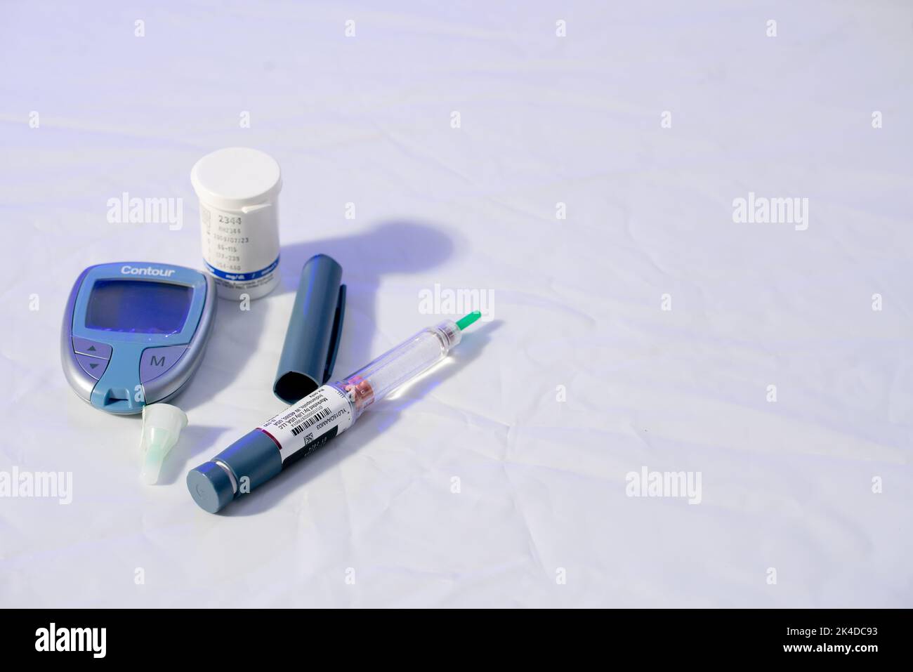 Insulin pen and blood glucose meter on white background Stock Photo - Alamy
