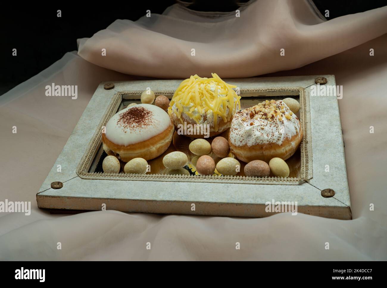Three doughnuts covered with Cookies and Creme, Butter Cheese ...