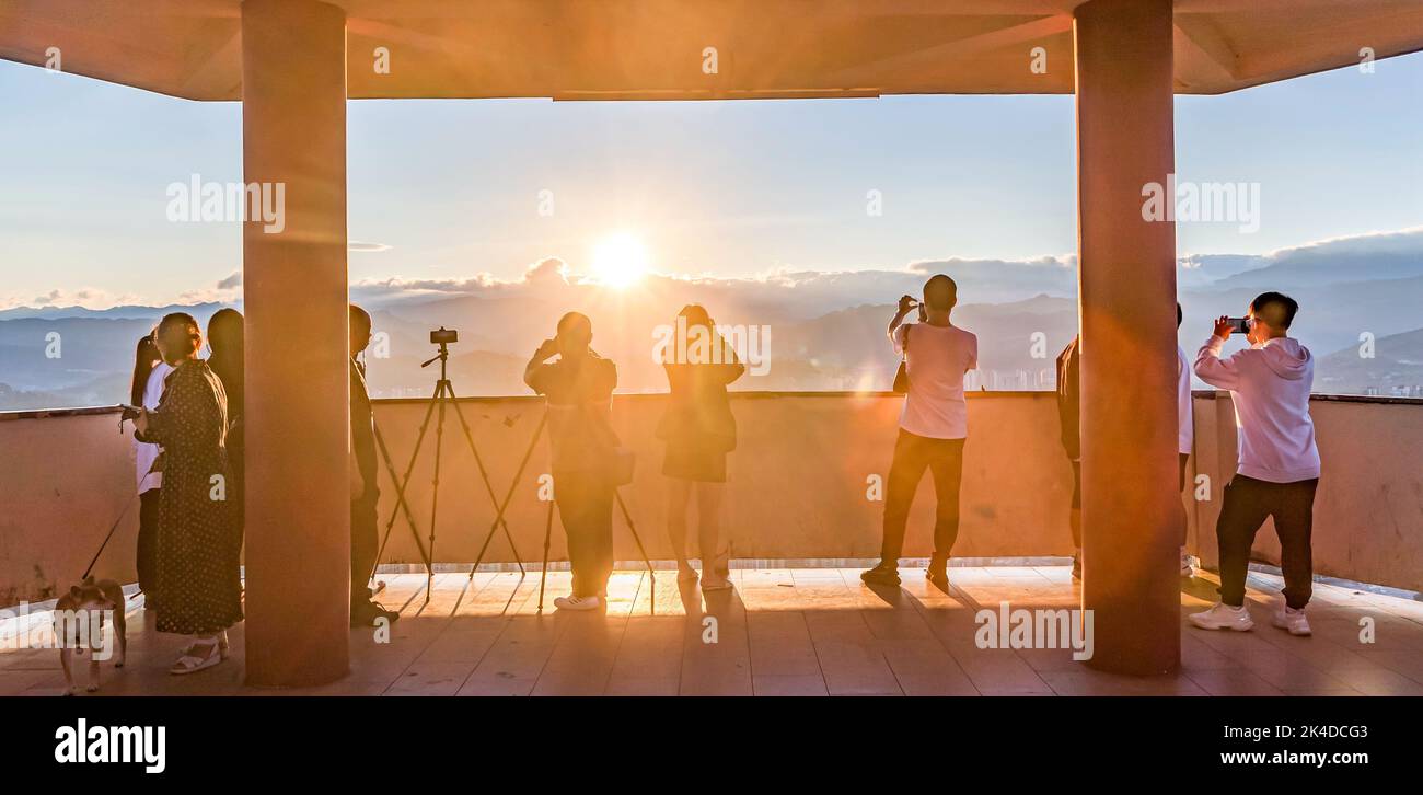 CHONGQING, CHINA - OCTOBER 2, 2022 - People take photos of sunrise flow waterfall in Chongqing ...