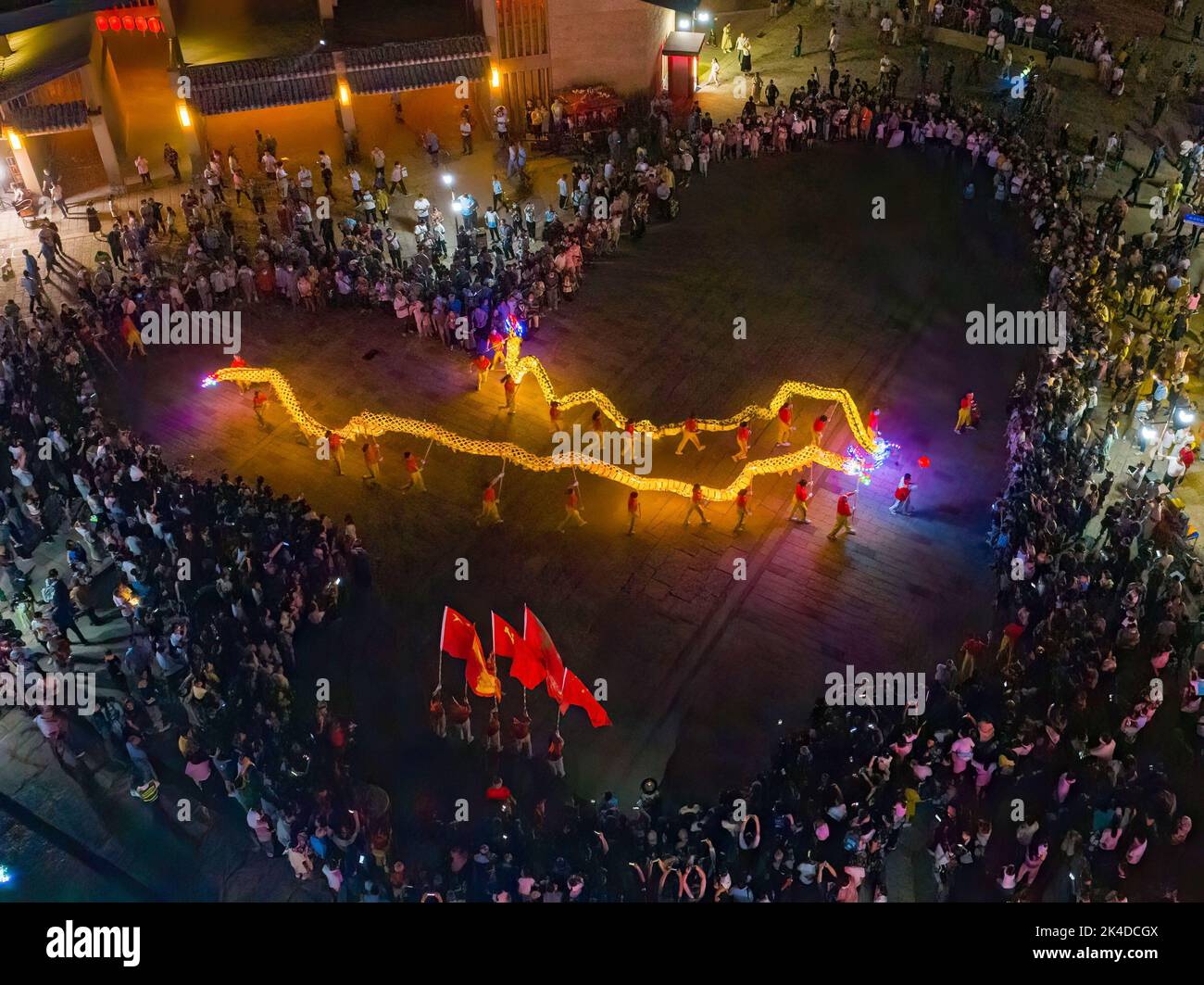 HEFEI, CHINA - OCTOBER 1, 2022 - Citizens watch a dragon dance ...