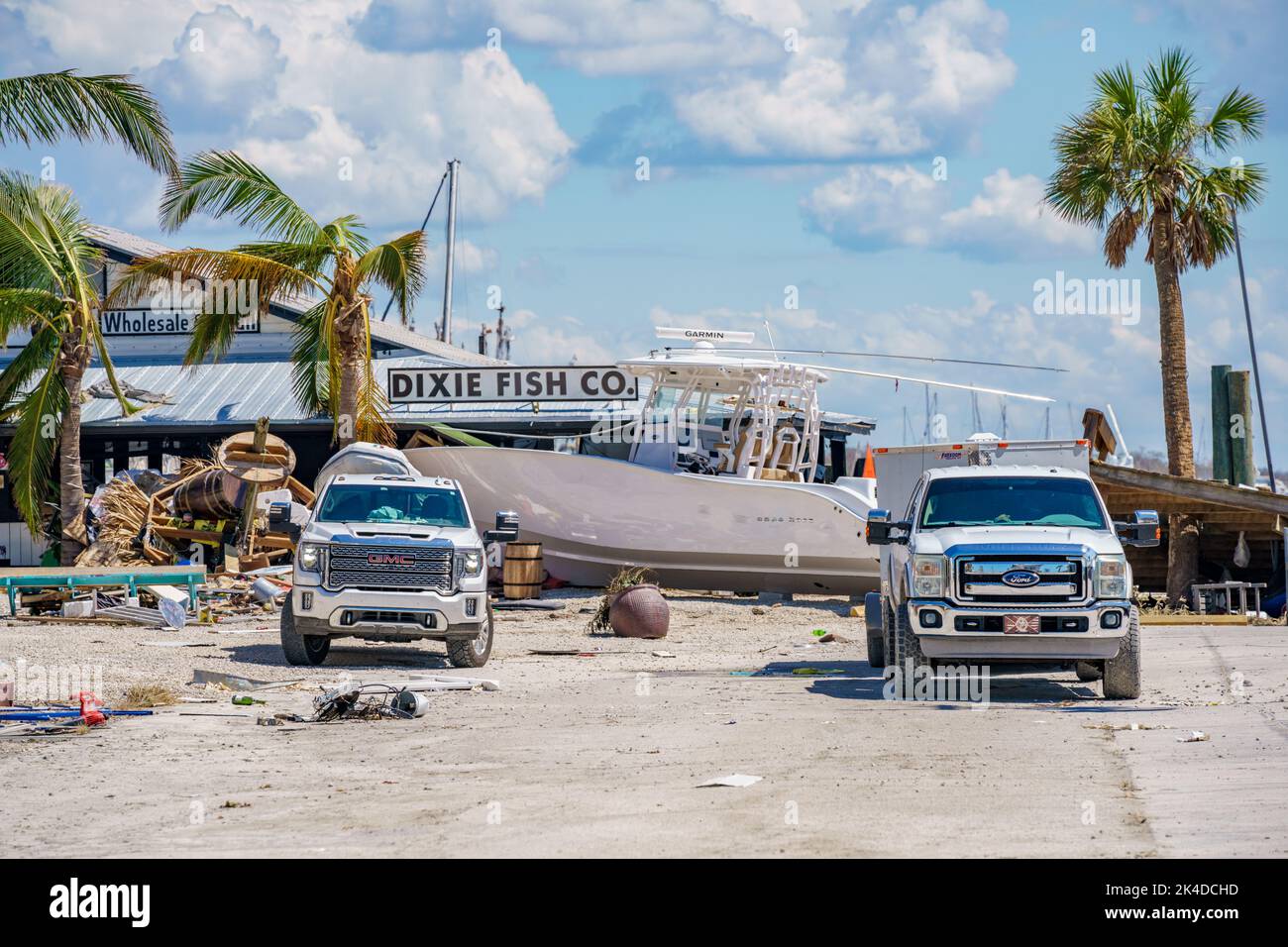 Fort Myers, FL, USA - October 1, 2022: Work trucks clearing out debris ...