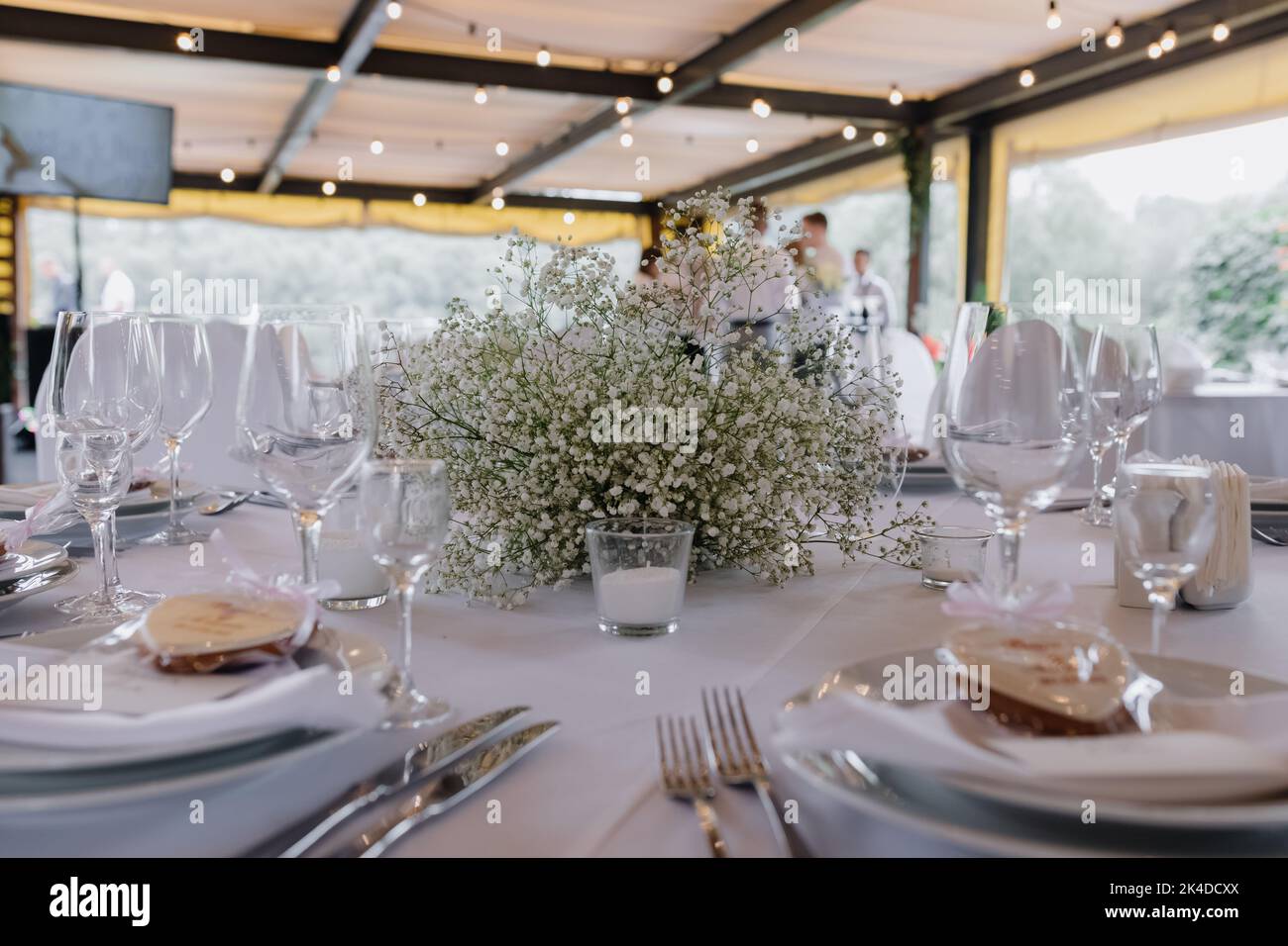 Table service for a party or wedding. luxury elegant dinner table setting in restaurant. glasses ...