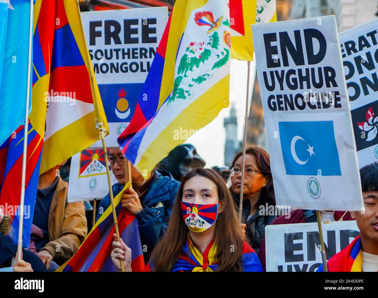 London, UK. 02nd Oct, 2022. Protesters seen hold flags of East ...