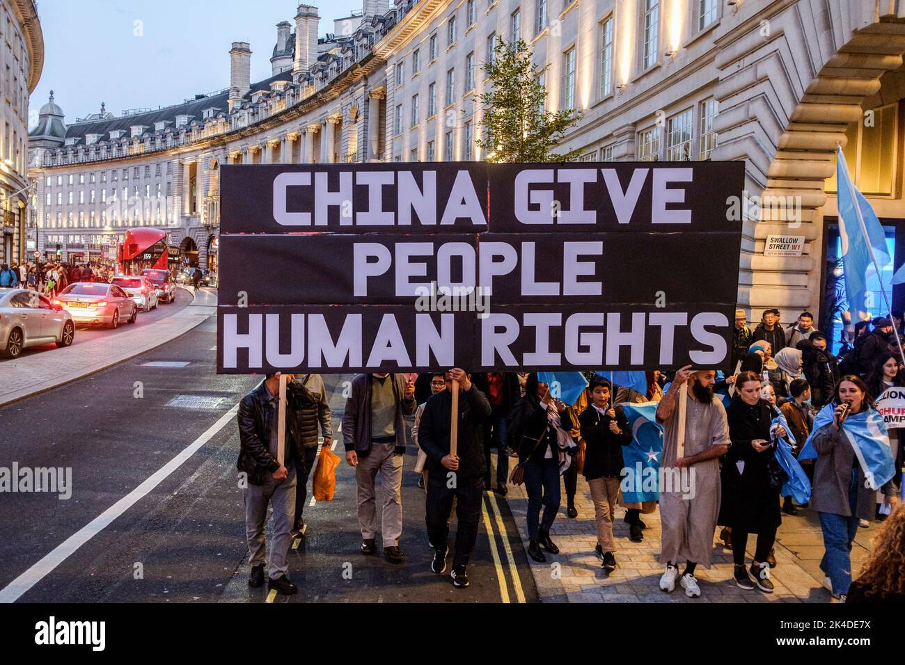 London, UK. 01st Oct, 2022. Protesters hold a placards saying "China ...