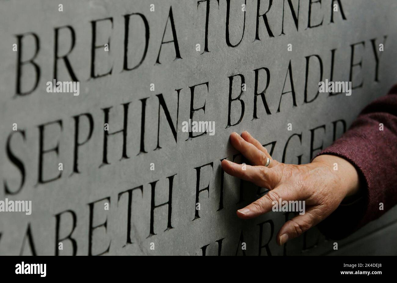 File photo dated 17/05/14 of a hand touching the memorial mark the 40th ...
