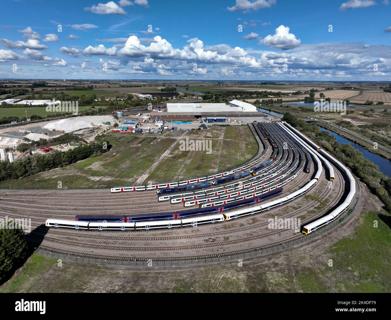 Ely, UK. 30th Sep, 2022. Trains are lined up and stored in sidings near ...
