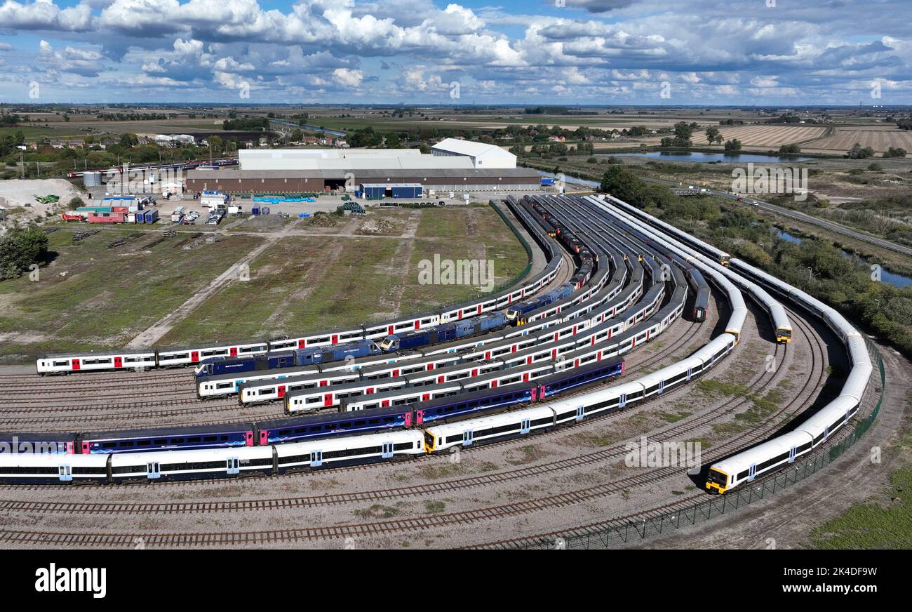 Ely, UK. 30th Sep, 2022. Trains are lined up and stored in sidings near ...