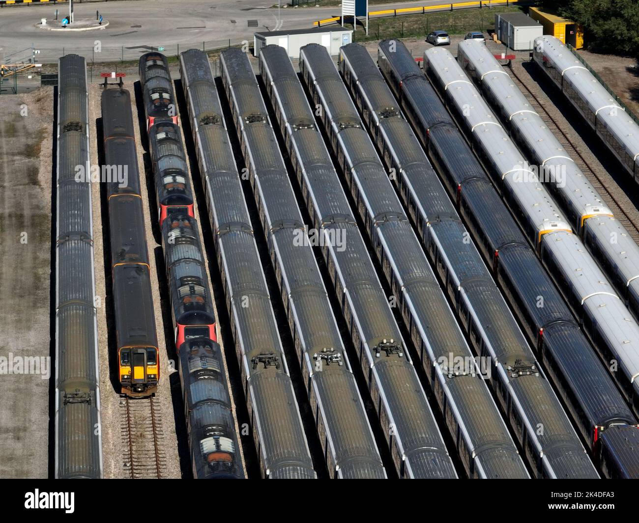 Ely, UK. 30th Sep, 2022. Trains are lined up and stored in sidings near ...