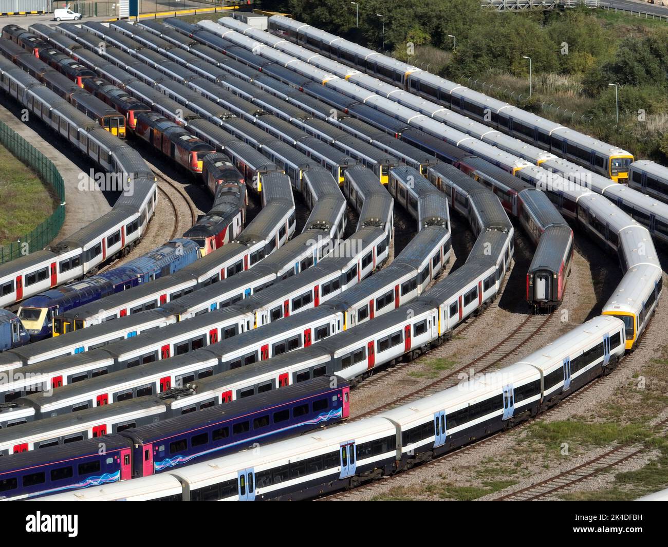 Ely, UK. 30th Sep, 2022. Trains are lined up and stored in sidings near ...