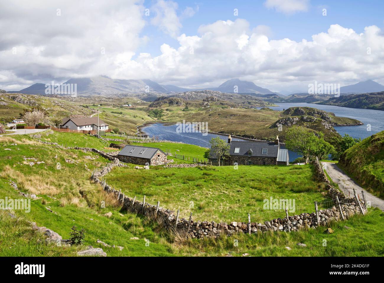 View over cottages and crofting fields by Loch Inchard, Sutherland ...
