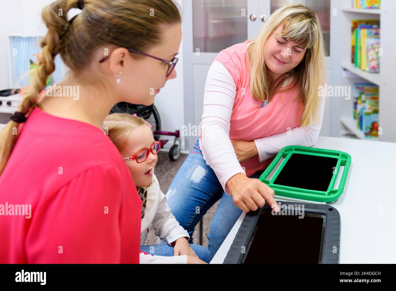 Non-verbal girl living with cerebral palsy, learning to use digital ...