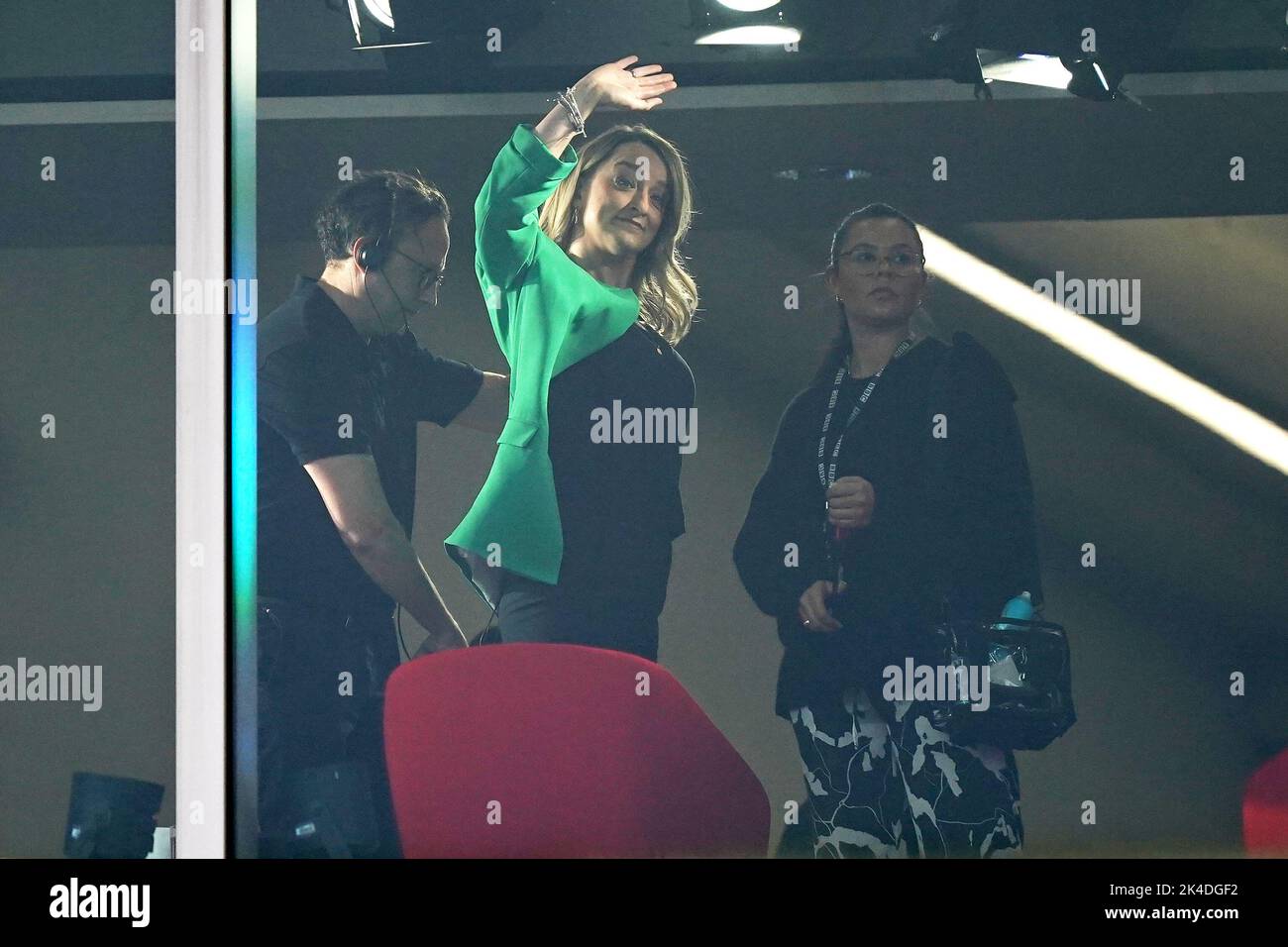 Laura Kuenssberg waves to the media gathered outside the BBC studio in ...