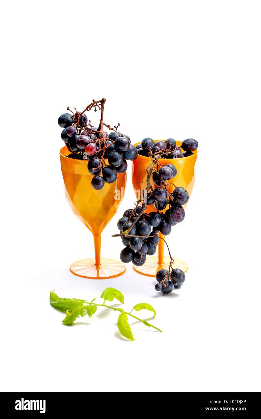 Bunches of ripe grapes in cups on a white background Stock Photo - Alamy