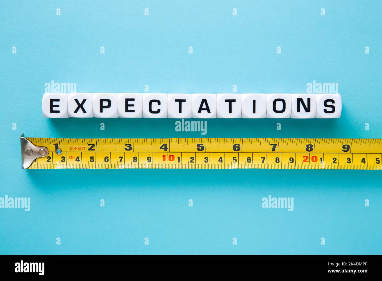 Tape measuring with Expectations word Stock Photo - Alamy