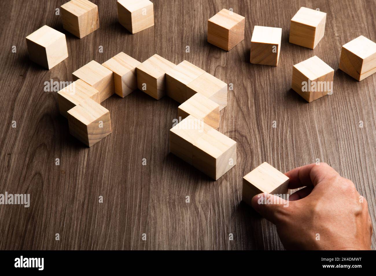 Question mark on wooden table background Stock Photo - Alamy
