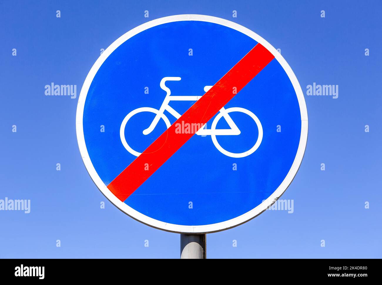 Not allowed sign for bikes lane against the blue sky. No bicycles ...