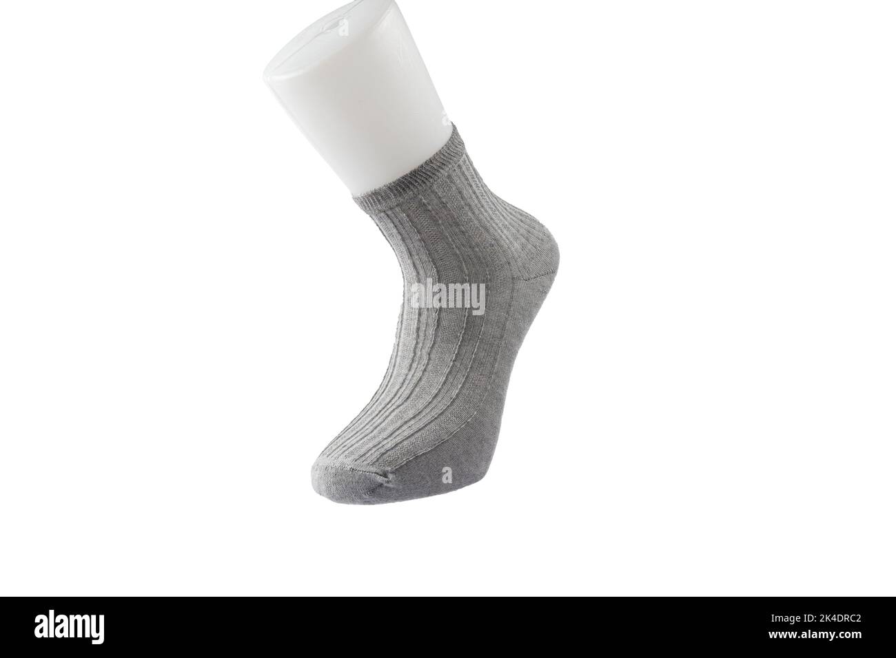 Side view of plastic foot wearing new beautiful and soft natural cotton ...