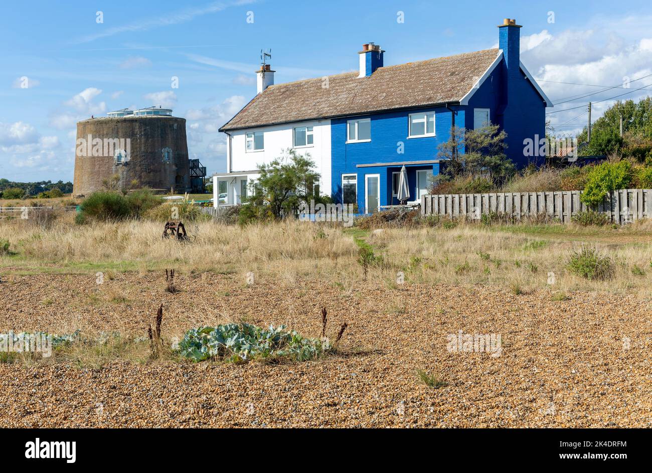 Martello tower and houses in coastal hamlet of Shingle Street, Suffolk ...