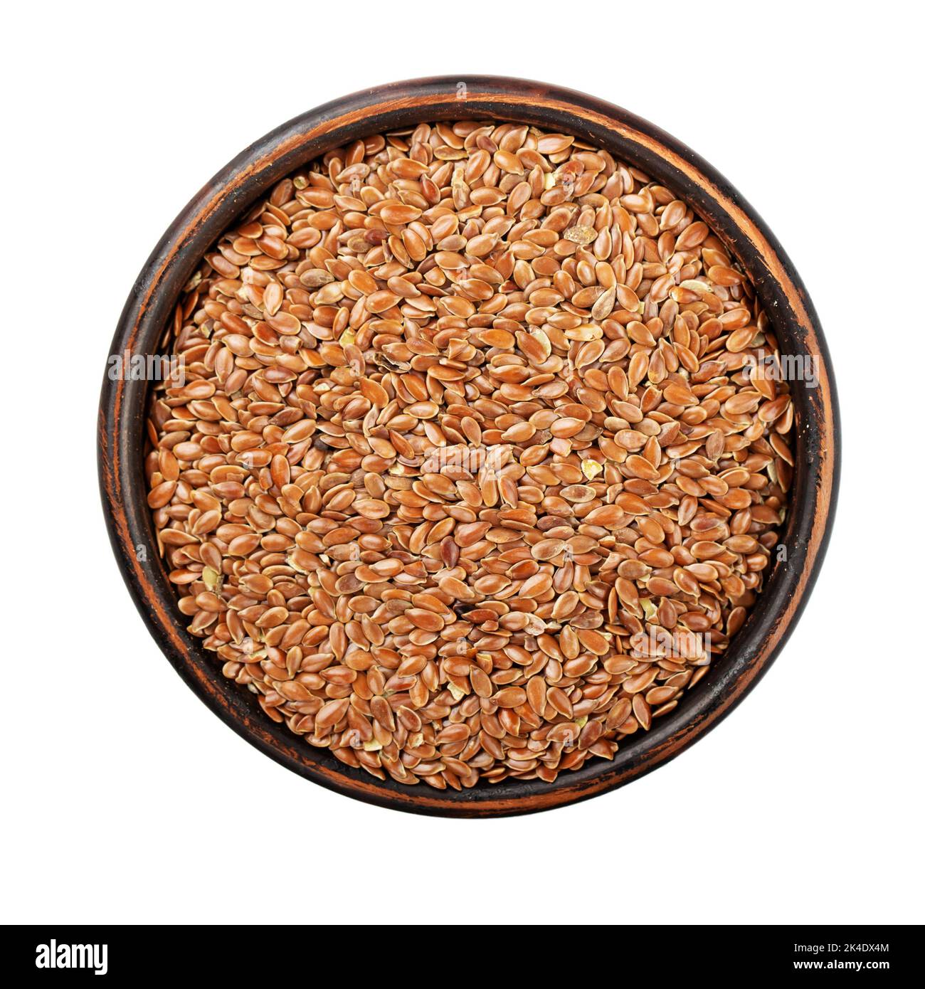 Clay bowl of flaxseed isolated on white background. File contains clipping path. Top view Stock ...