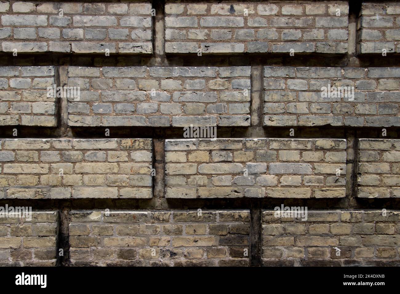 Old weathered beige brown brick wall background Stock Photo - Alamy