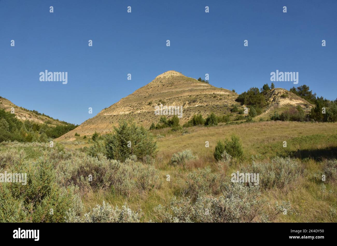 Hardened sandstone pyramid mound in the bacllands of North Dakota Stock ...