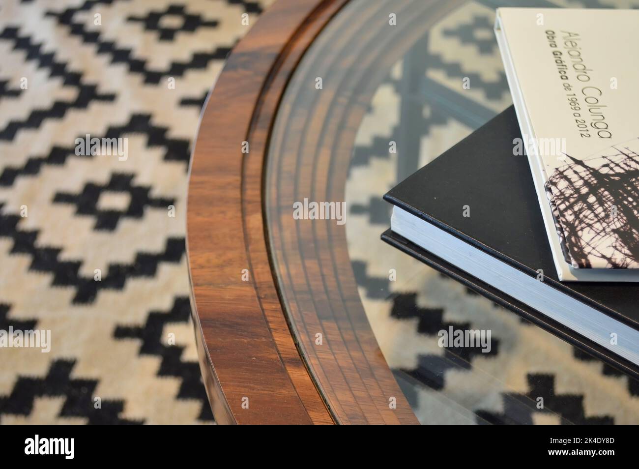Double table in brown wood, with circular metal edges and several glass ...