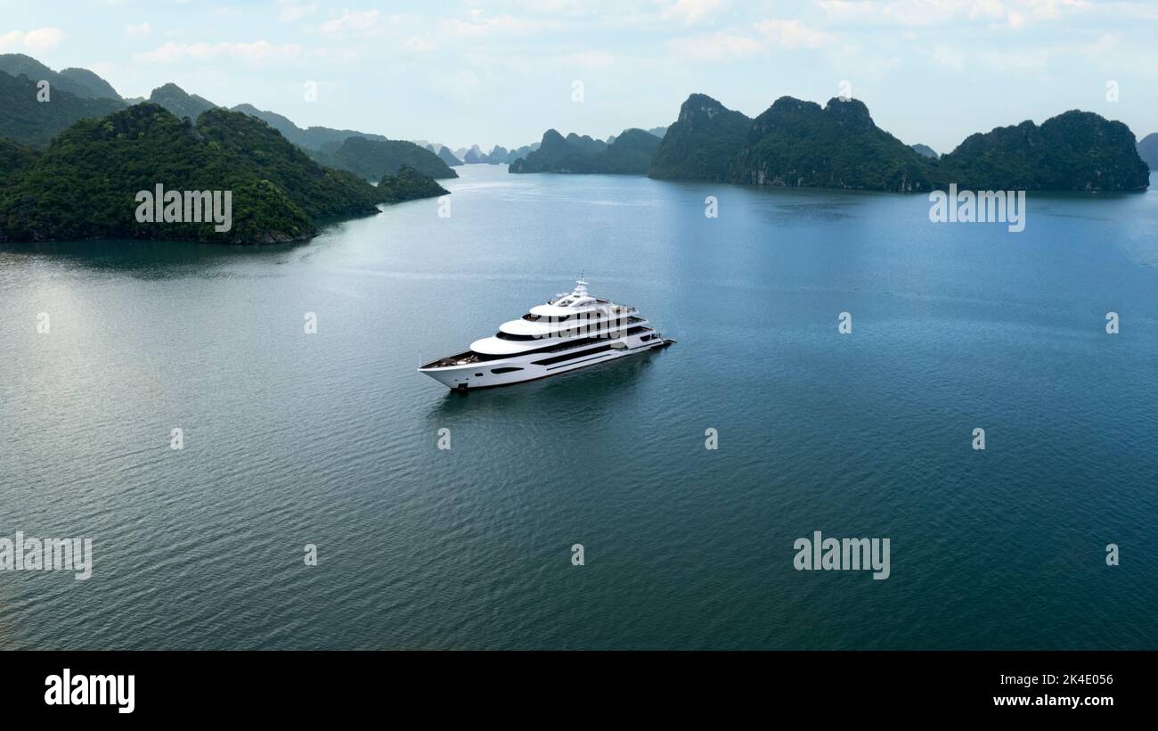 beautiful white luxury mega yacht in tropical Ha Long Bay Vietnam with ...
