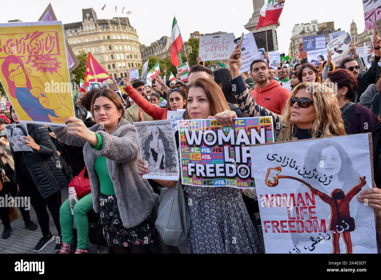 Protesters hold placards expressing their opinion during the ...
