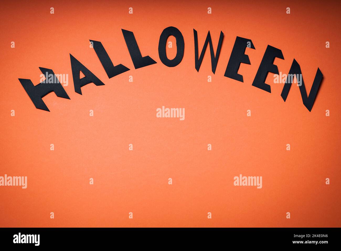 Halloween lettering with black letters on an orange background ...