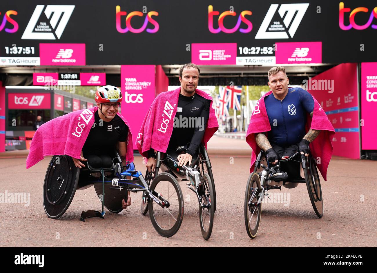Switzerland's Marcel Hug (centre) poses after winning the Men's Elite ...