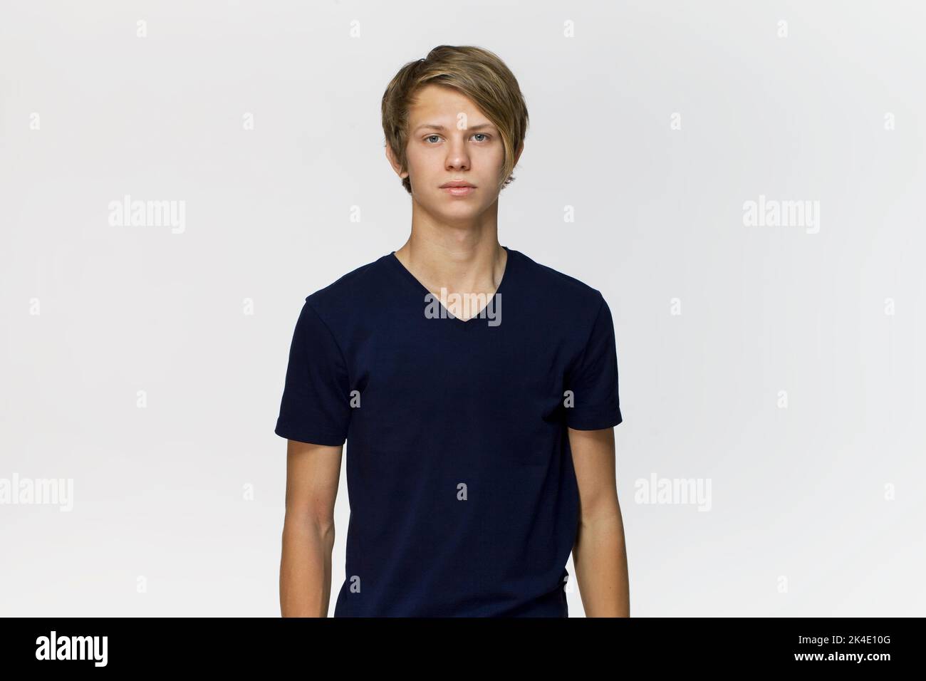 Man in blue shirt wearing hi-res stock photography and images - Alamy